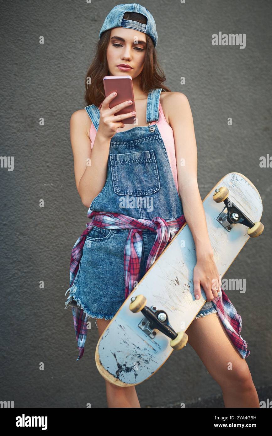 Girl, skateboard and smartphone with texting confidence and sports ...
