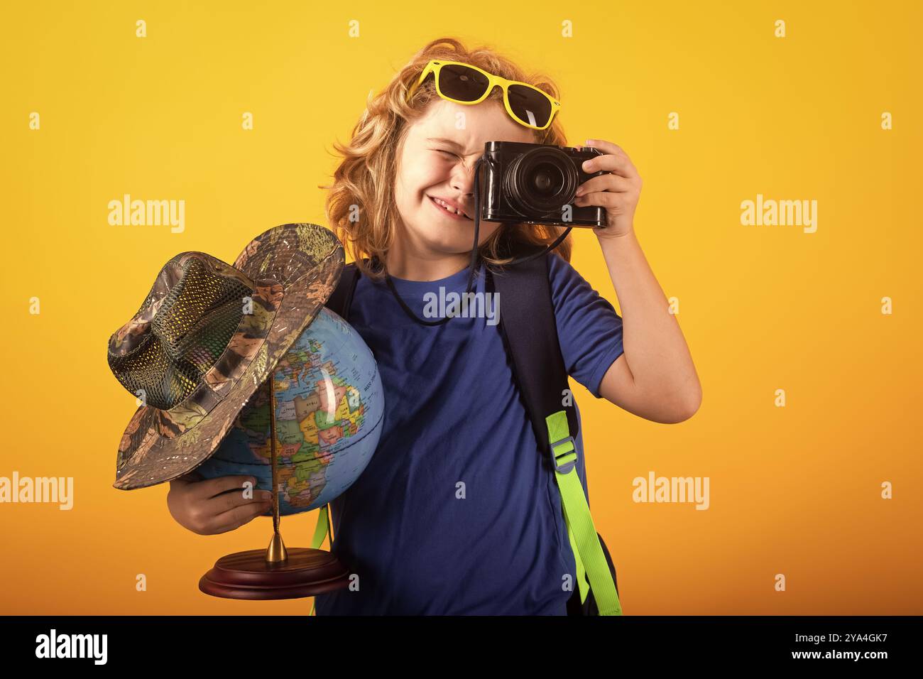 Travel and adventure concept. Little child boy tourist explorer with ...