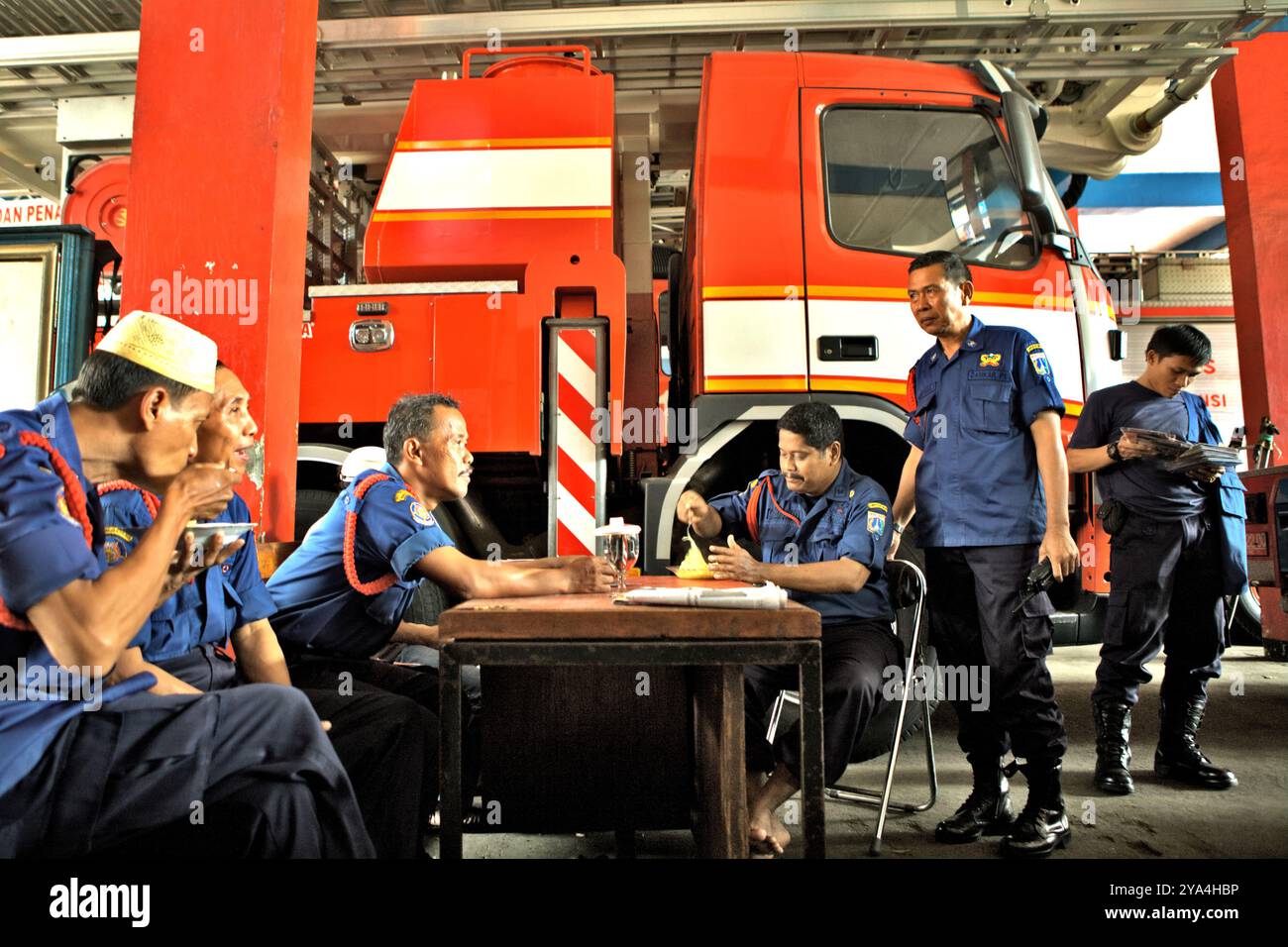 Firefighters having a relax time at their station in Petojo, Central ...