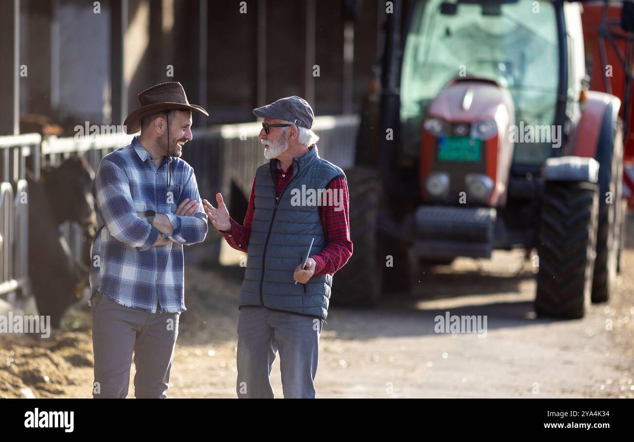 Two smiling farmers talking hi-res stock photography and images - Alamy