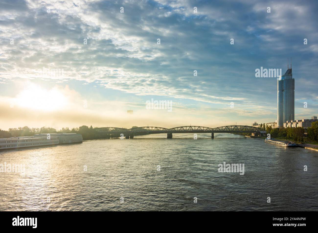 Vienna: river Donau (Danube), sunrise, mist, DC Tower 1 (left ...