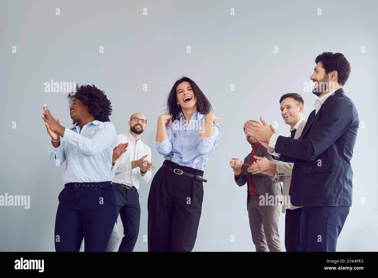 Office Team Celebrating Success with Dancing and Applause Stock Photo ...