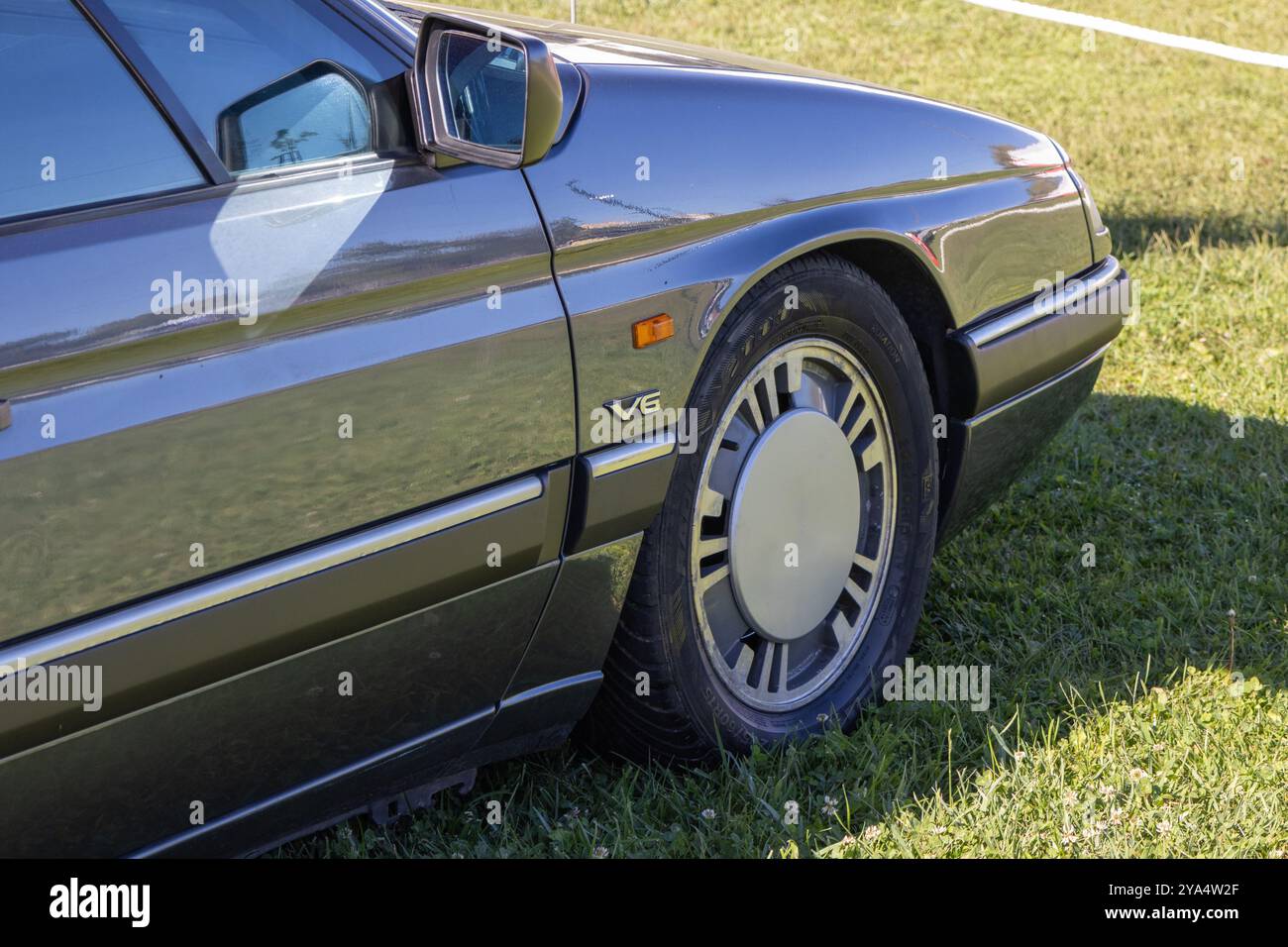Citroen xm v6 with alloy wheel parked on a grass field during a sunny ...