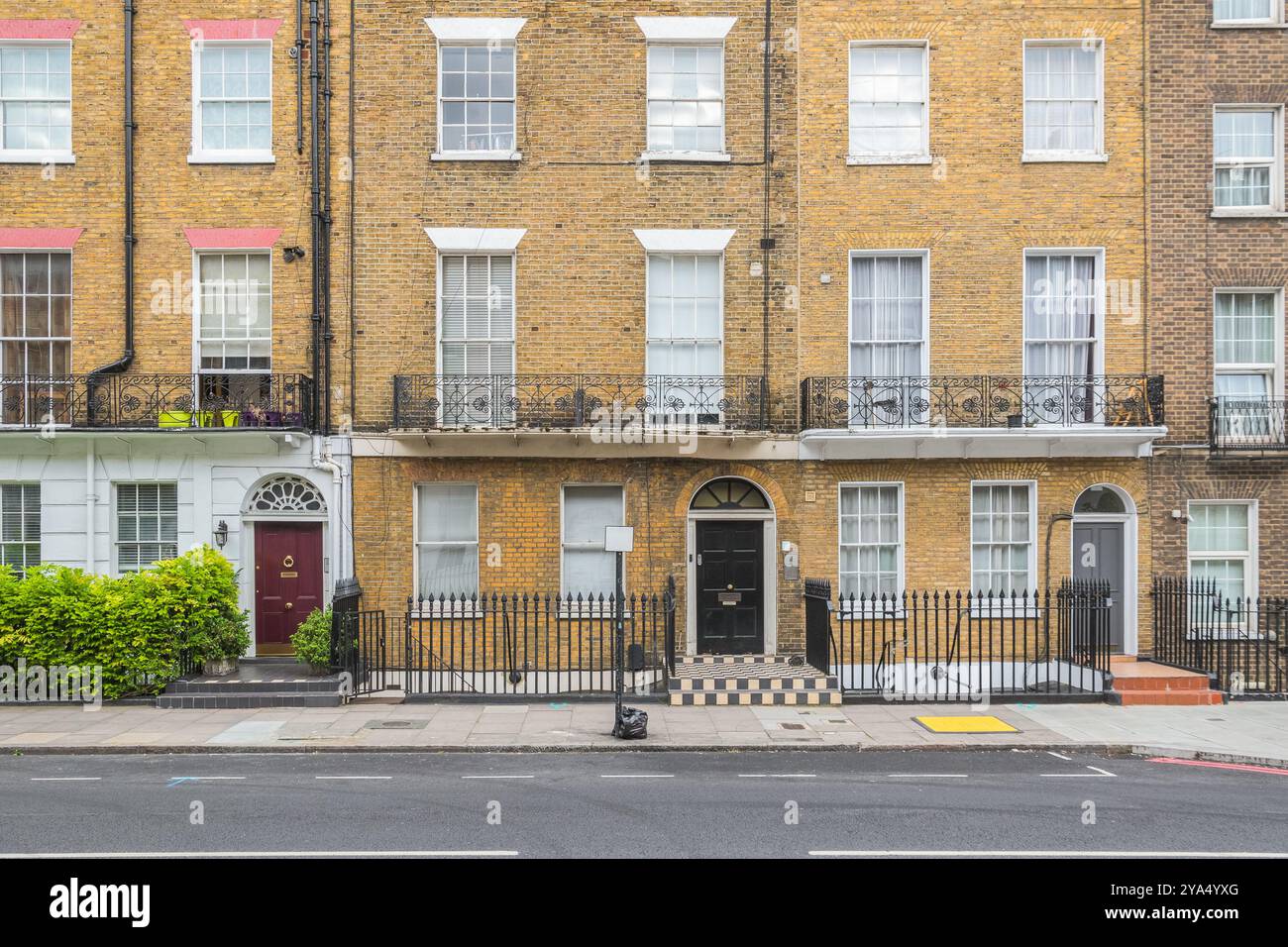 Facade of Georgian style terraced houses around Marylebone in London ...