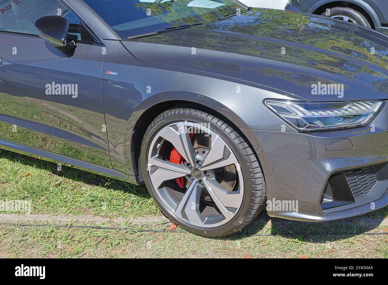 Modern gray audi a7 sportback parked on the grass, showing its alloy ...