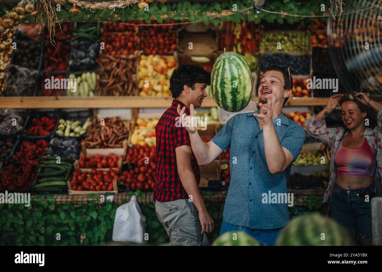 Friends having fun buying fresh fruits and vegetables at outdoor market ...