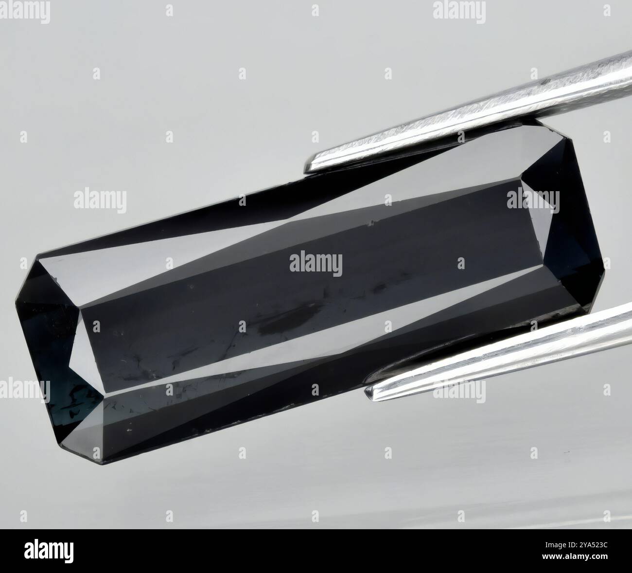 Exquisite Black Tourmaline Crystal with Faceted Edges Captured in ...