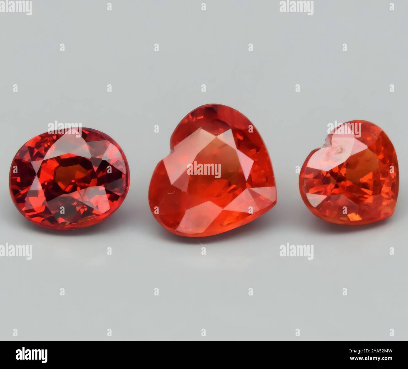 Exquisite Display of Radiant Red Natural Gemstones in Heart and Oval ...