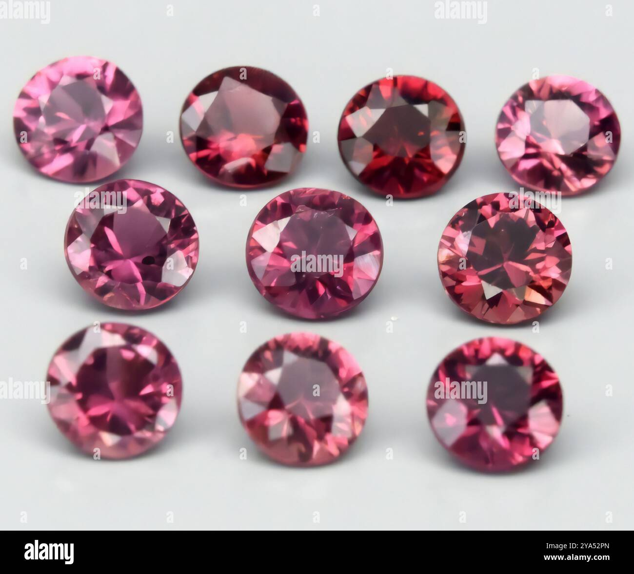 Exquisite Display of Vibrant Natural Pink Gemstones in a Symmetrical ...