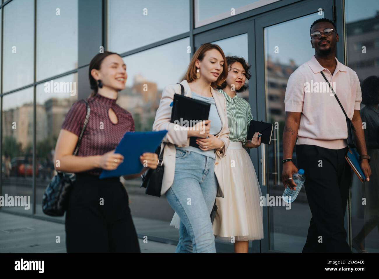 Multiracial people walking together after hi-res stock photography and ...