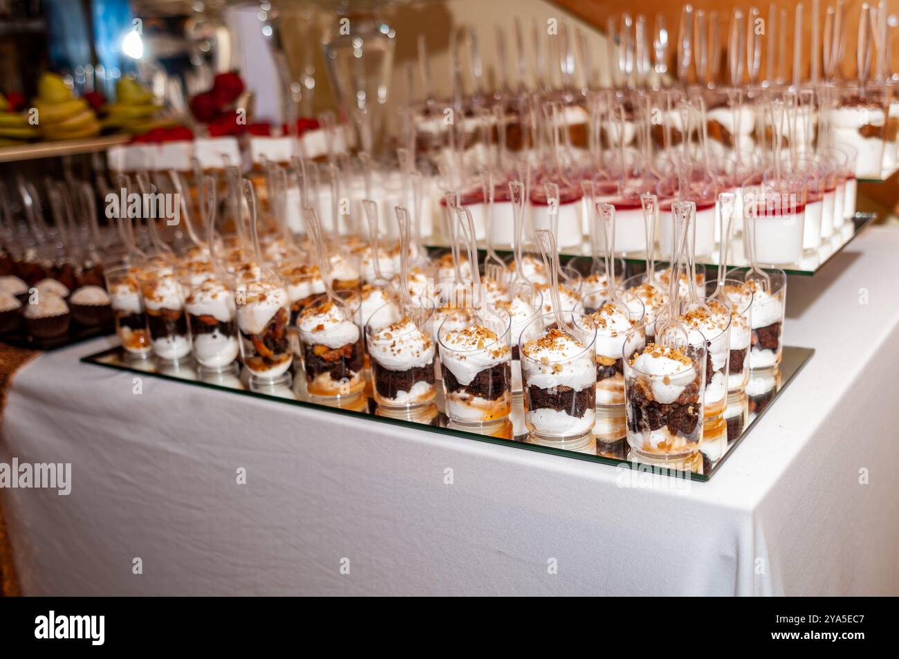 Elegant Dessert Table Featuring Mini Parfaits and Cupcakes Stock Photo - Alamy