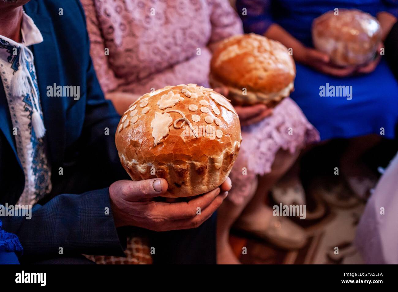 Traditional Ukrainian Bread Ceremony with Decorated Loaves Held by ...