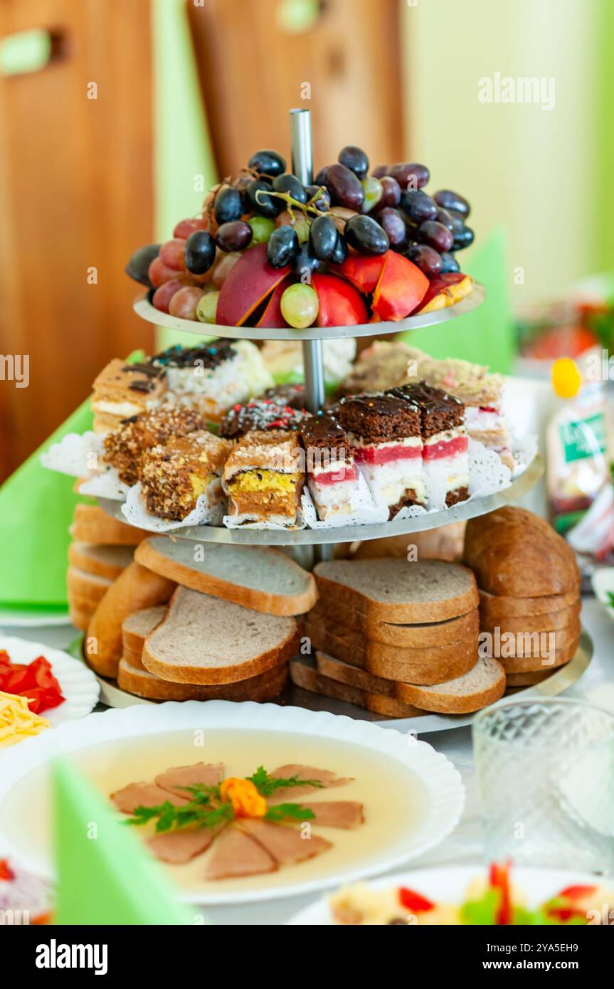 Elegant Multi-Tiered Dessert Stand Adorned with Fruits and Treats Stock ...