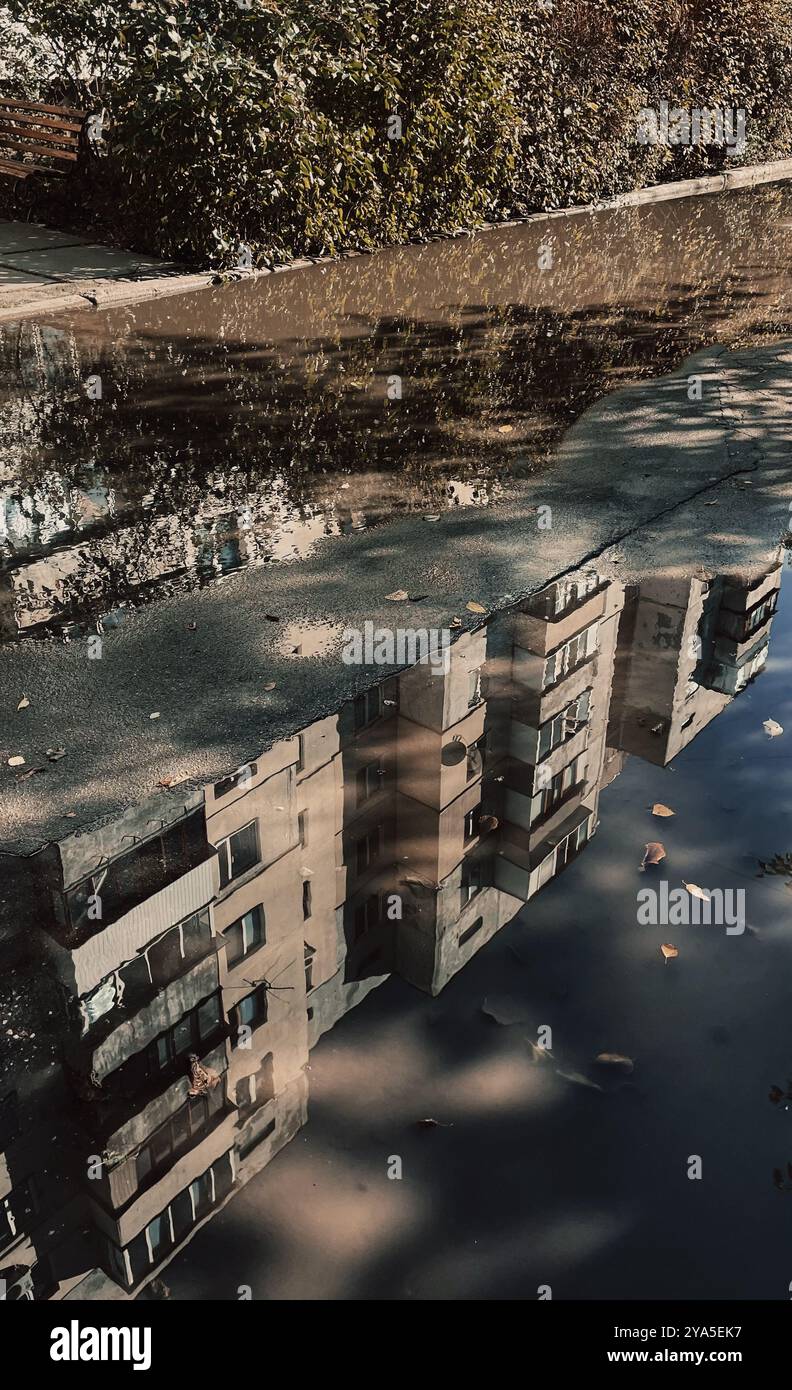 Reflection of a house in a puddle Stock Photo - Alamy