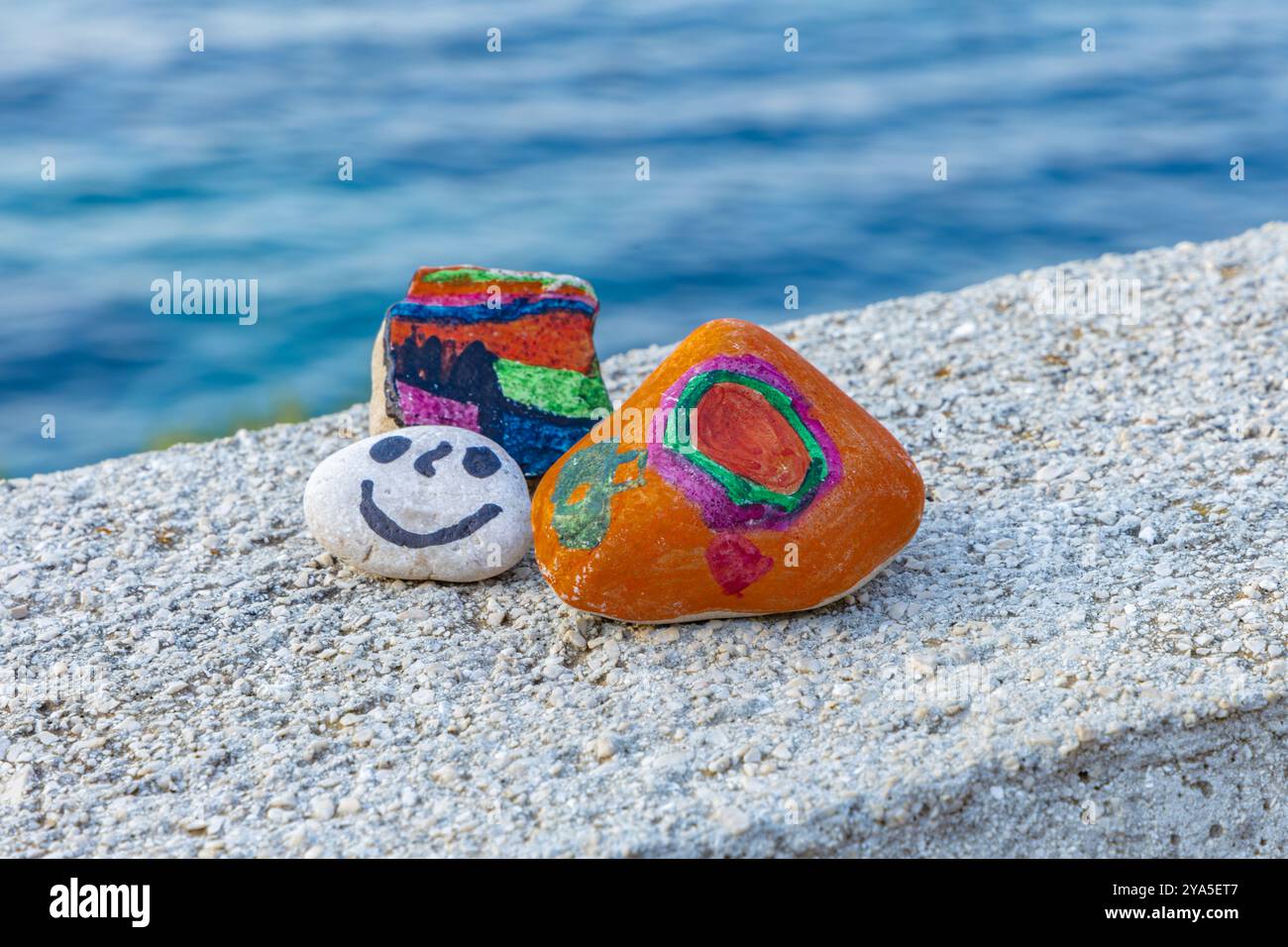 Colorful pebbles painted into patterns by children Trpanj Croatia Stock ...