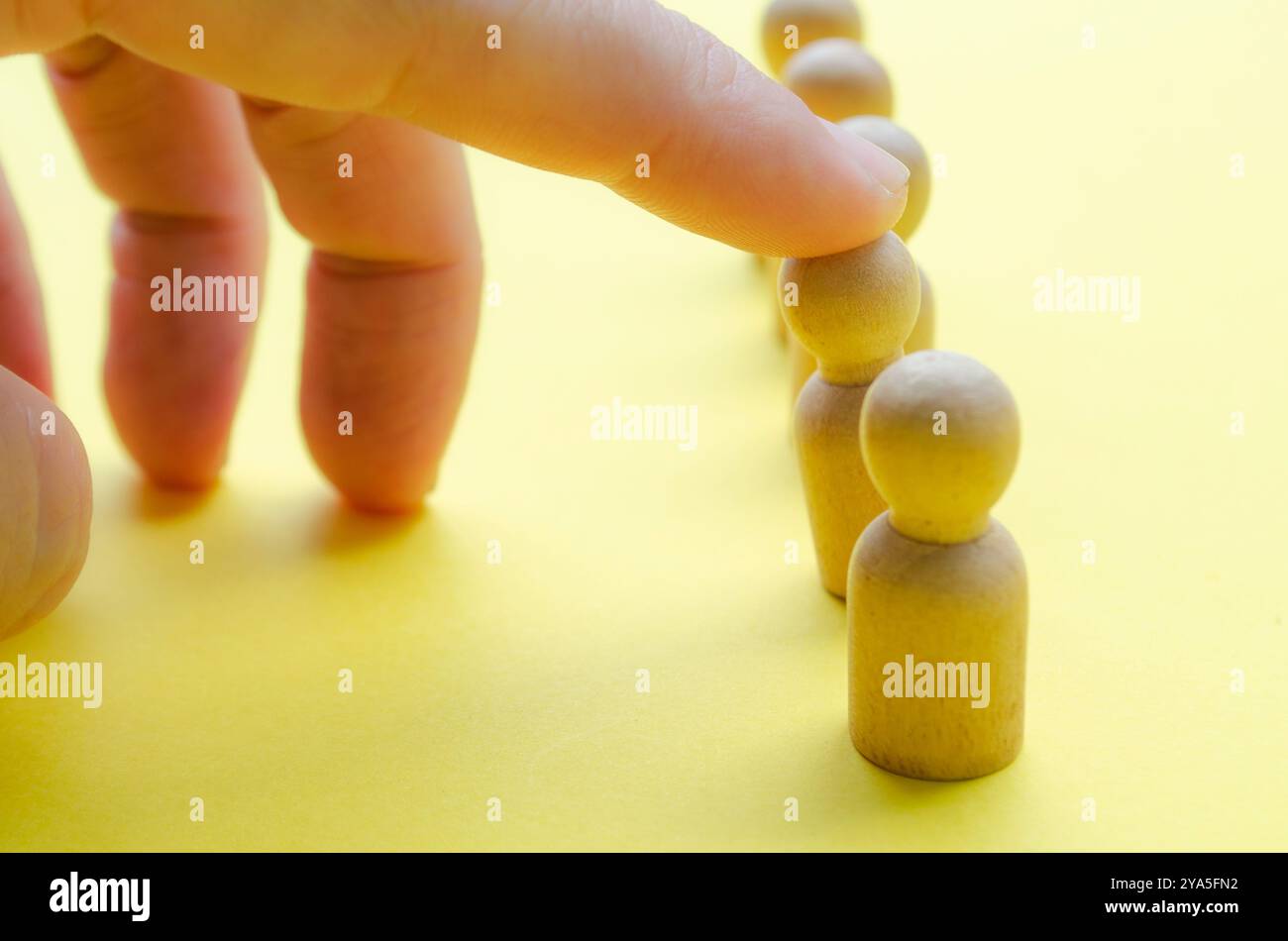 The chosen wooden figure representing a leader Stock Photo - Alamy