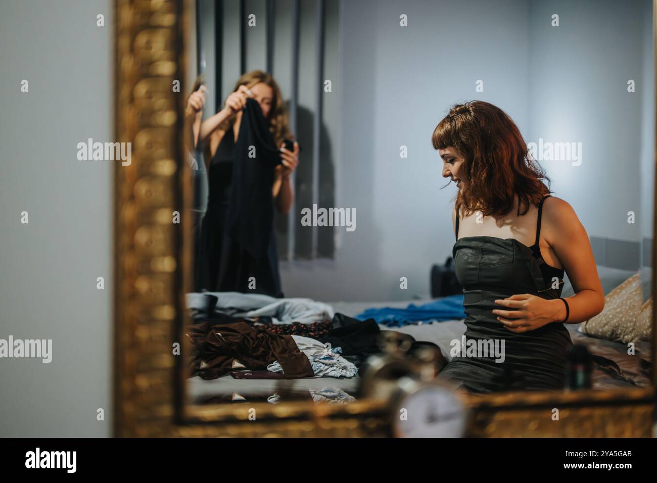 Friends getting ready for night out hi-res stock photography and images ...