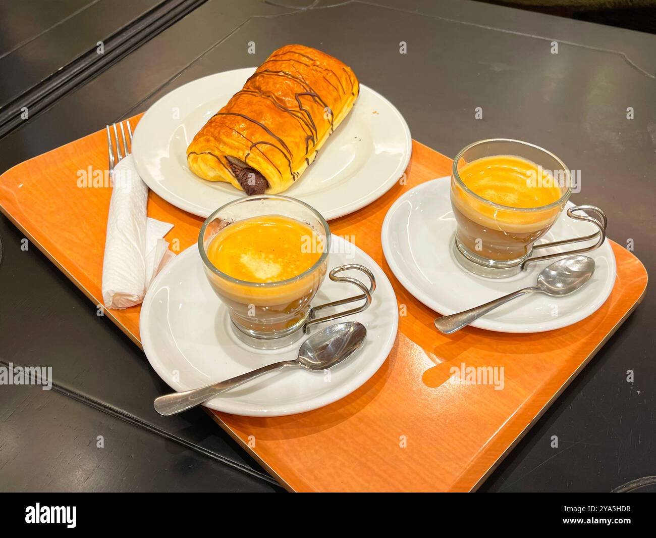 Two cups of coffee and puff pastry cake Stock Photo - Alamy