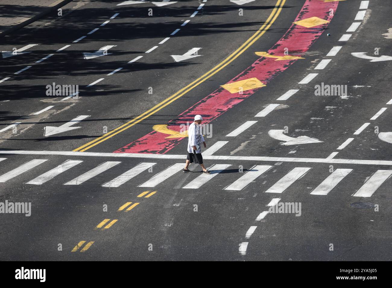 RELIGION-ISRAEL/YOM KIPPUR A person walks on a crosswalk at an empty ...