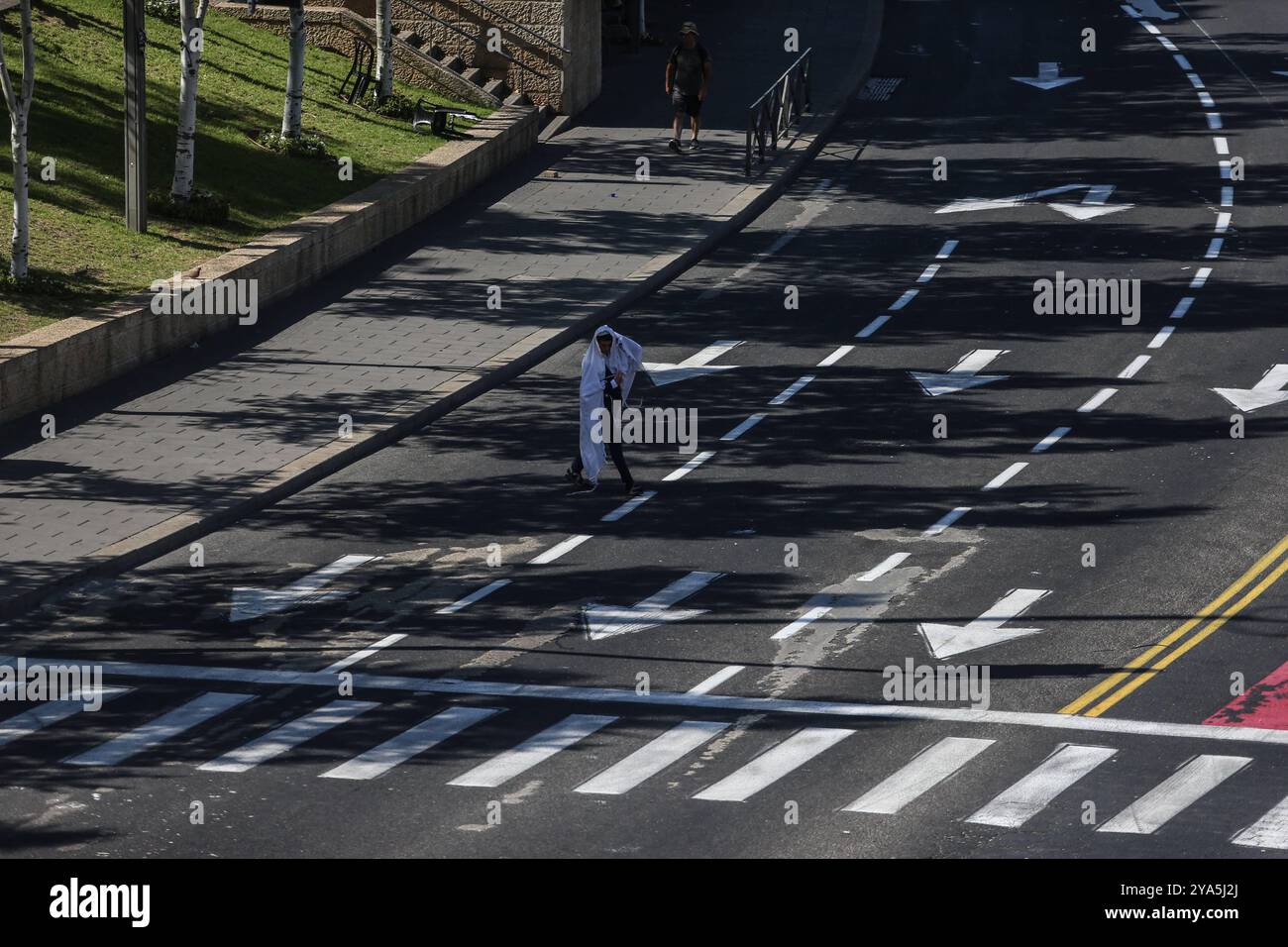 RELIGION-ISRAEL/YOM KIPPUR A person walks on a crosswalk at an empty ...