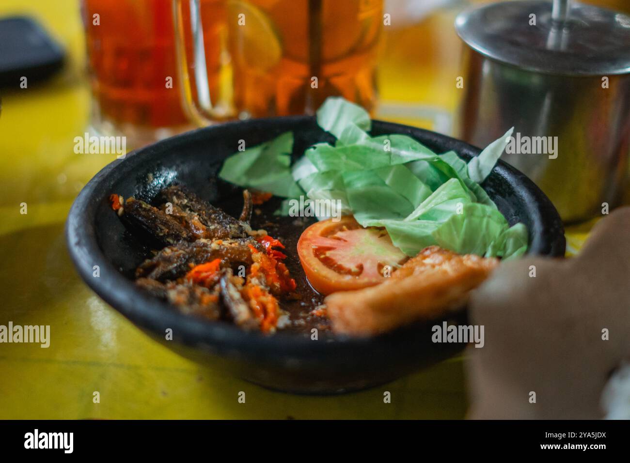 spicy fish and tempeh fried with raw veggie Stock Photo - Alamy