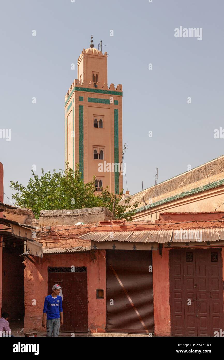 The minaret of the Ben Youssef Mosque dominates the medina of Marrakech ...