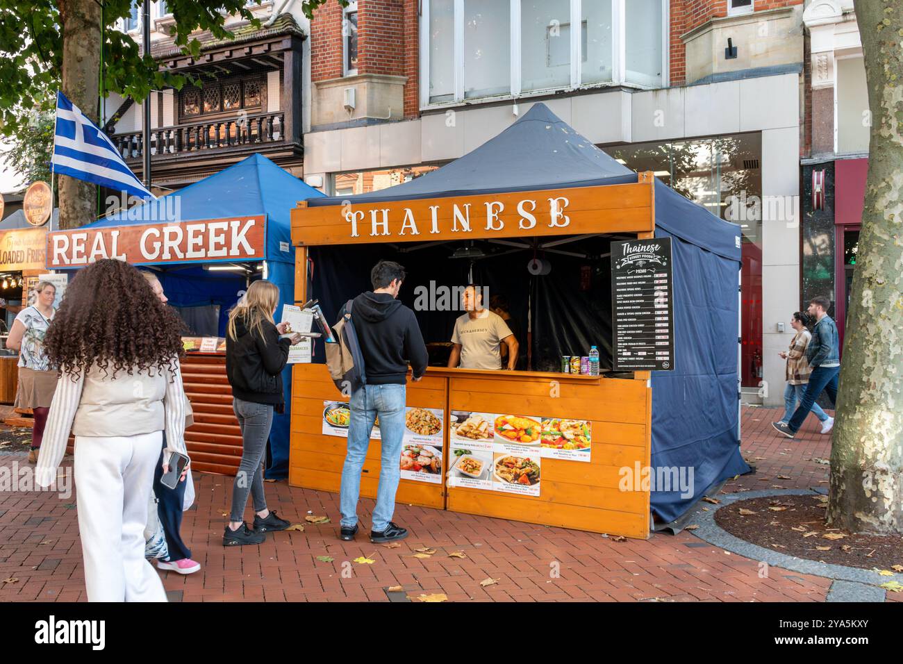 Food stalls with people at the October Market along Broad Street in ...