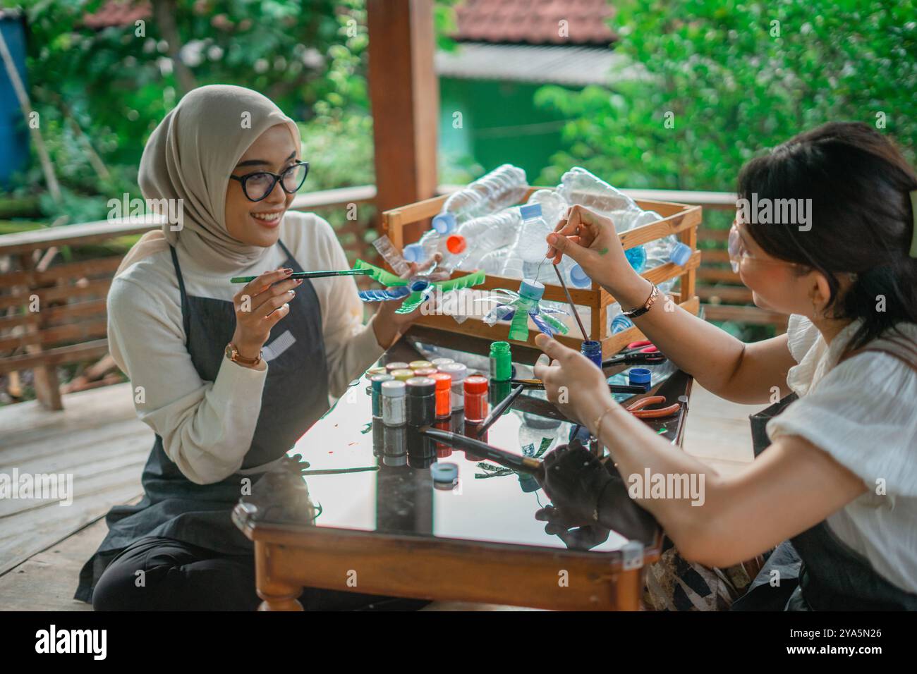 asian women creating handmade craft from plastic waste Stock Photo - Alamy