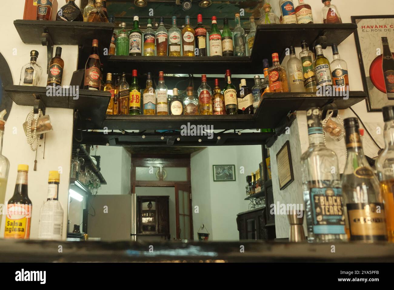 Havana, Cuba - Apr1 2024: Wall display of a variety of alcoholic drinks ...