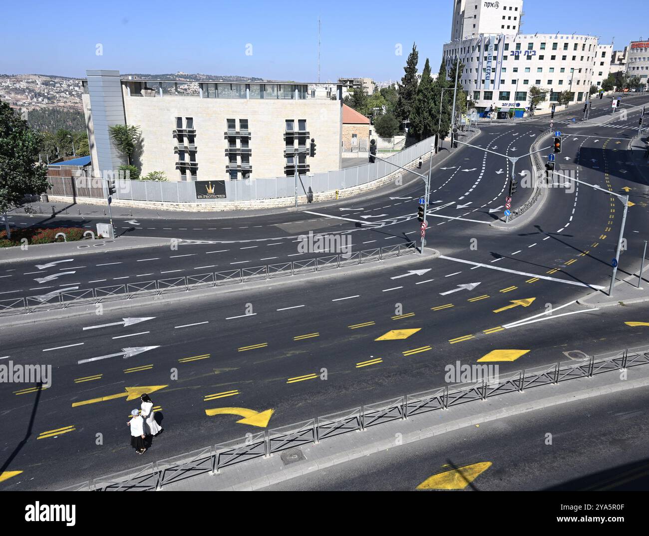 Jerusalem, Israel. 12th Oct, 2024. Ultra-Orthodox Jews walk on an empty ...