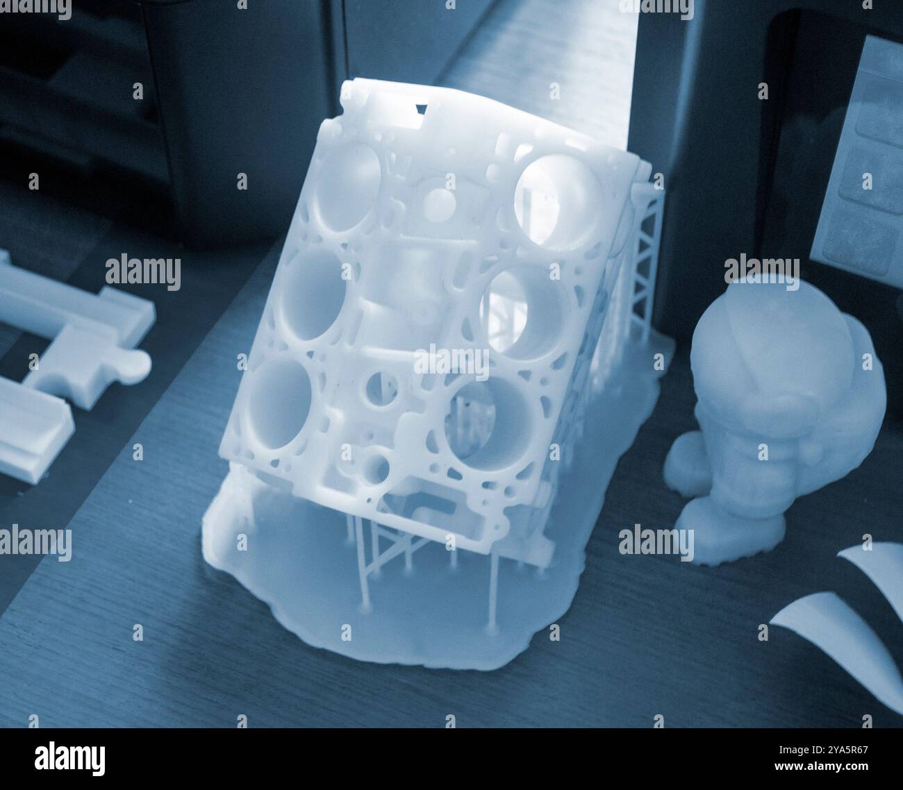 Prototype of car engine printed on 3D printer from molten white plastic ...