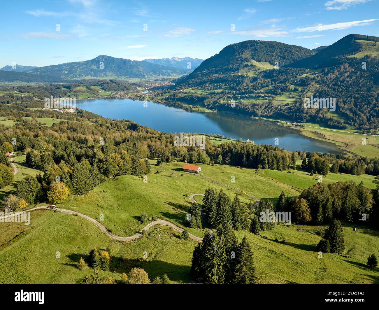 Aerial landscape in the Allgaeu Alps with lake Alpsee next to ...