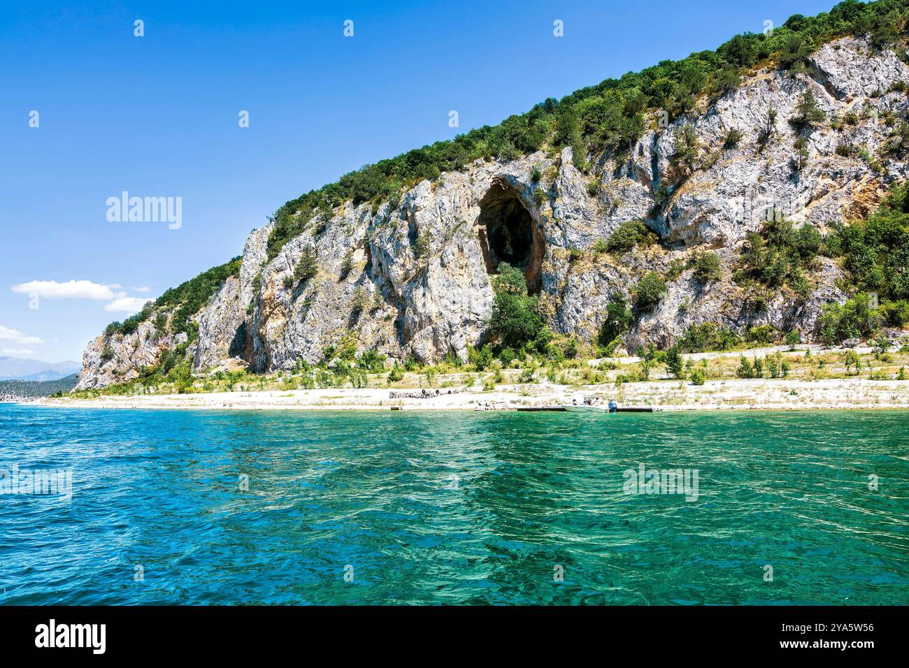 An image of a rocky cliff at Megali Prespa Lake, featuring an ancient ...