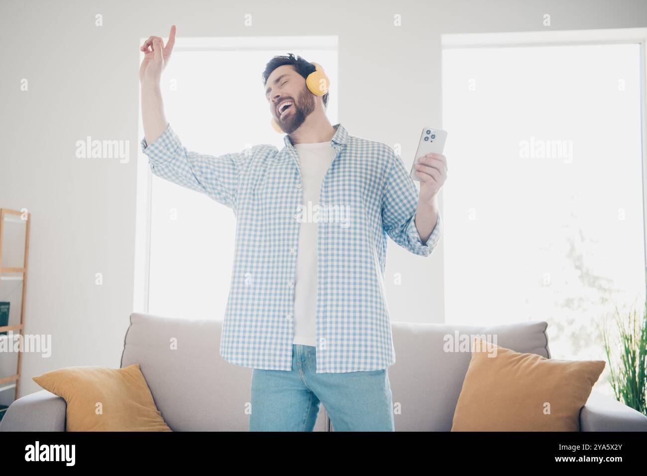 Photo of handsome bearded funky adult man staying home alone in his new ...