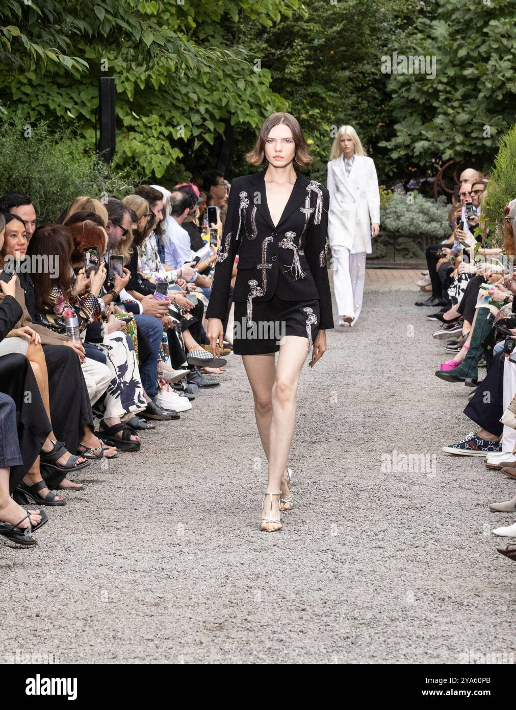 A model walks the runway for the Libertine by designer Johnson Hartig ...