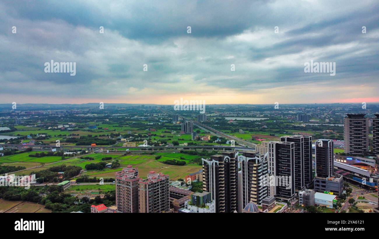 A sprawling urban landscape with modern high-rise buildings and roads ...