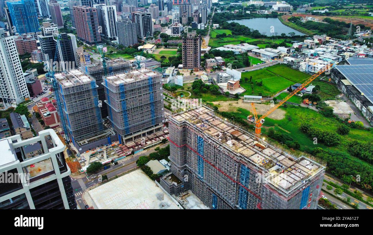 A sprawling urban landscape with modern high-rise buildings and roads ...