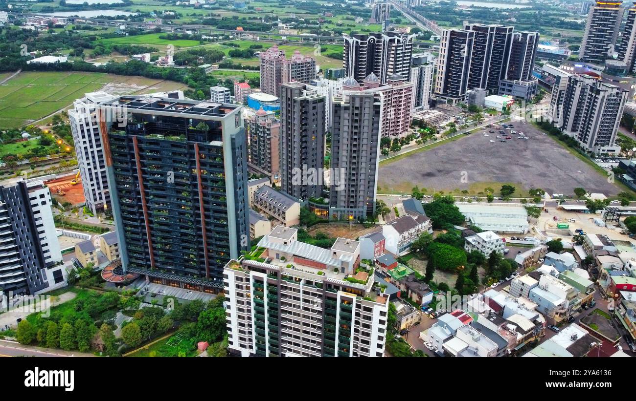 A sprawling urban landscape with modern high-rise buildings and roads ...