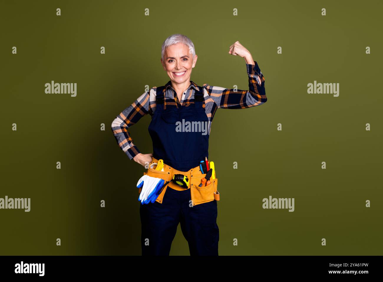 Mature woman flexing biceps hi-res stock photography and images - Alamy