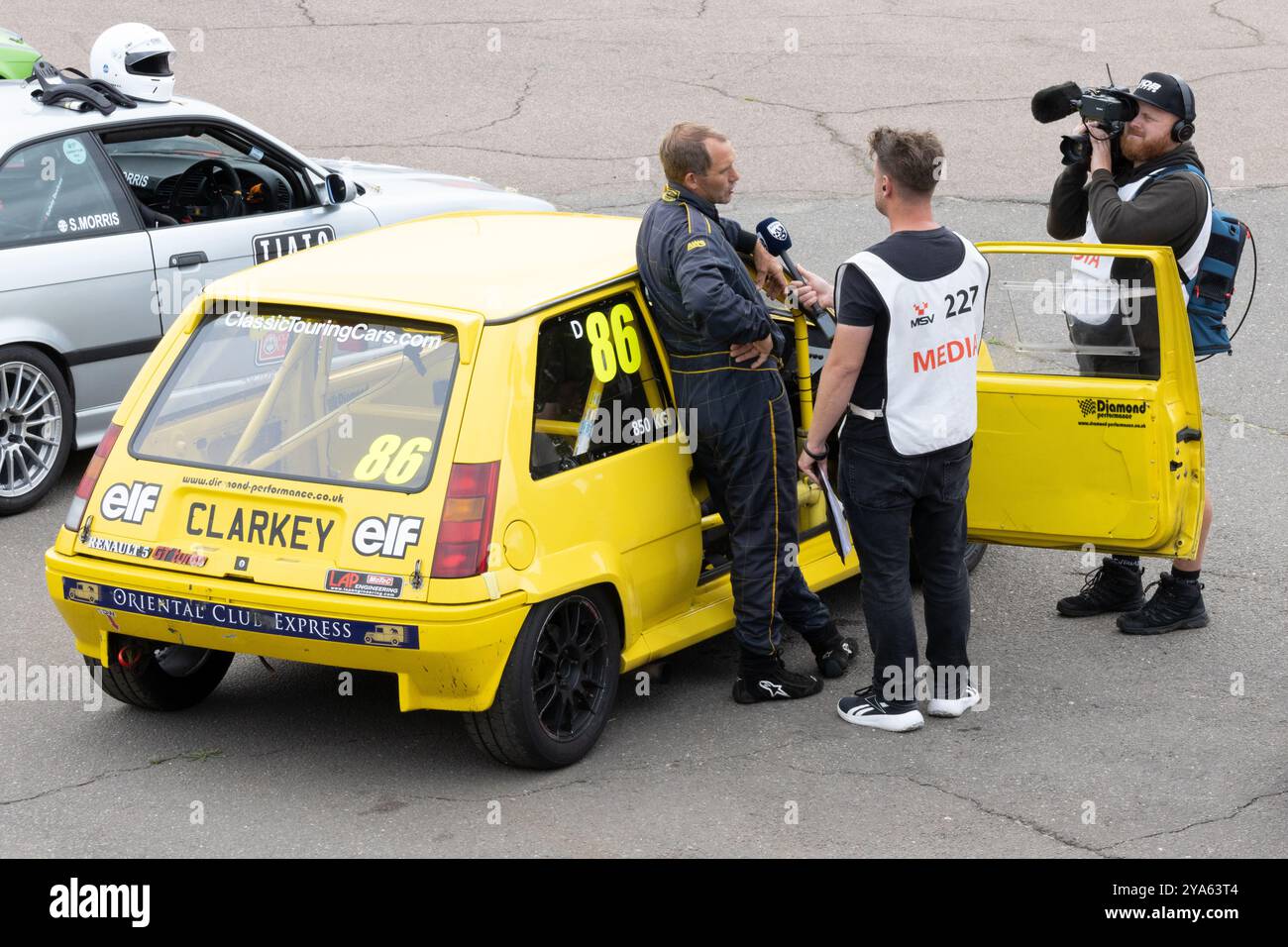 David Clark with his Renault 5 GT Turbo being interviewed in the ...