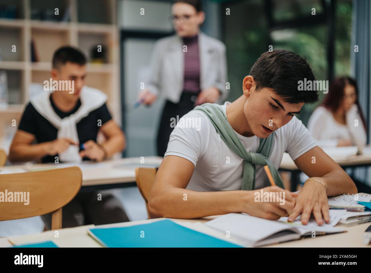 Focused students participating in a classroom environment Stock Photo ...