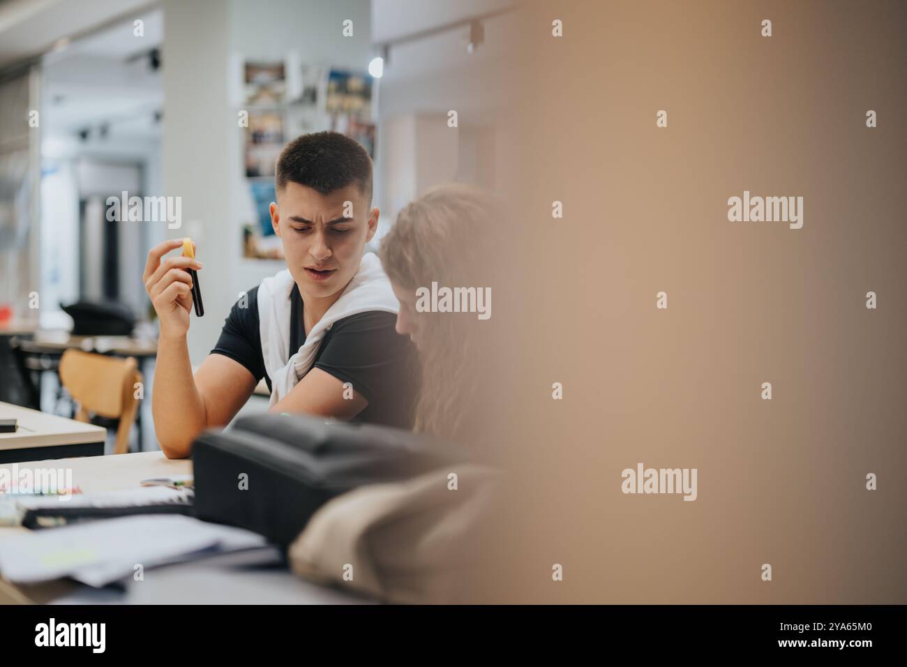Students collaborating on a project in a modern classroom Stock Photo ...