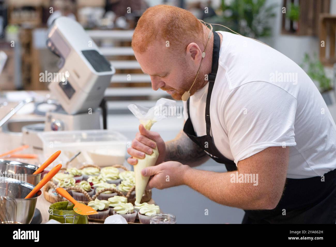 Hanover, Germany. 12th Oct, 2024. Raheem Haidar spreads pistachio ...
