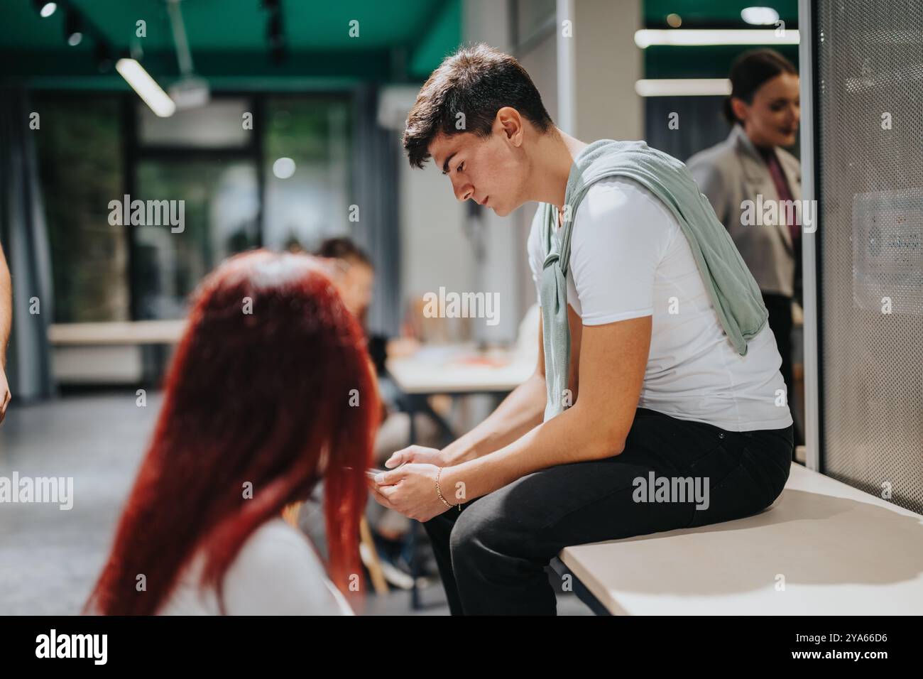 Teens talking in classroom hi-res stock photography and images - Alamy