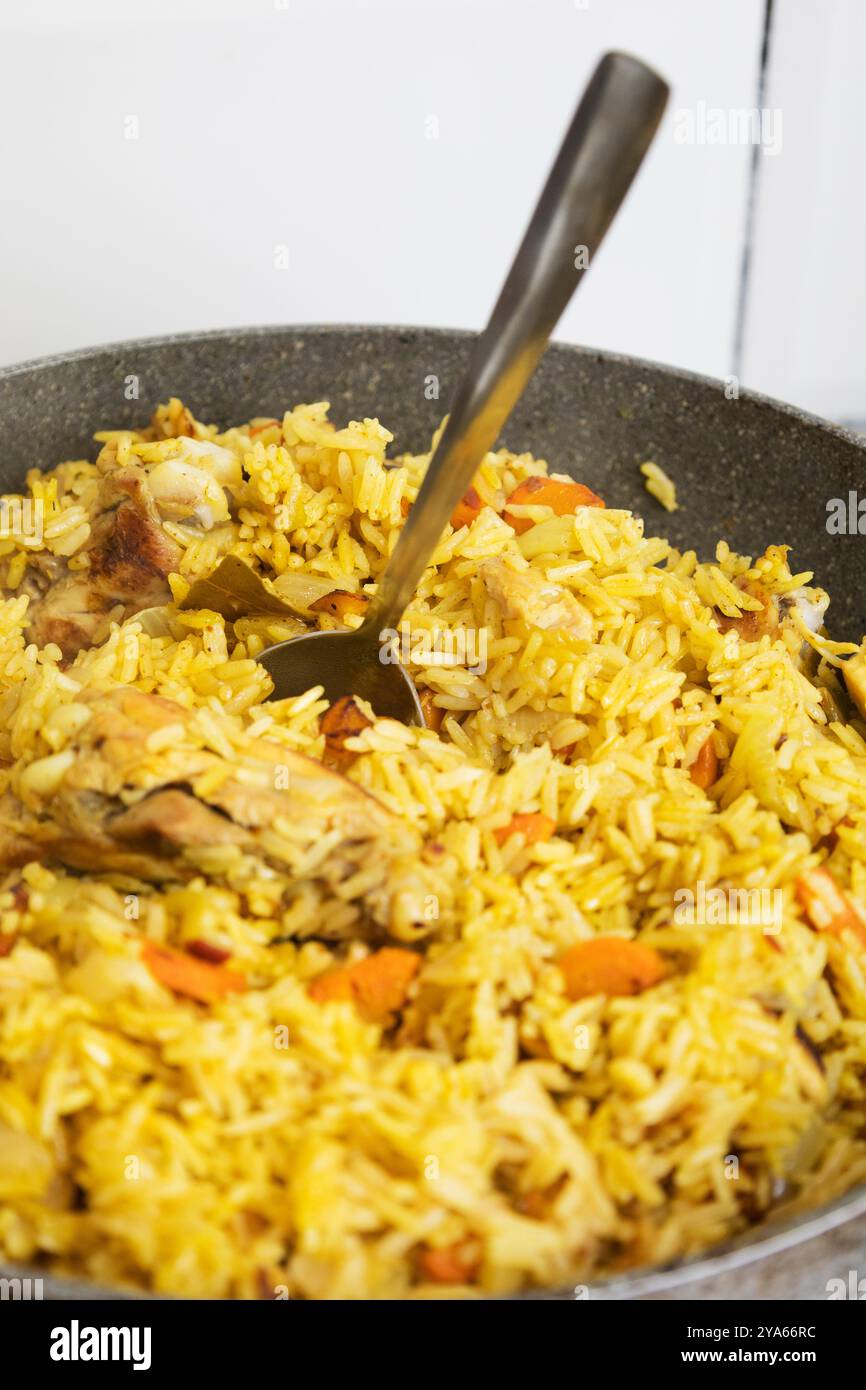 Cooking rice fork pan hands hi-res stock photography and images - Alamy