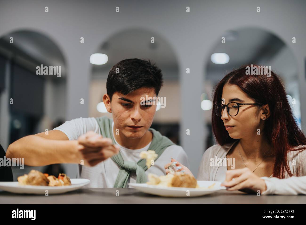 High school students enjoying a meal together in a cafeteria Stock ...