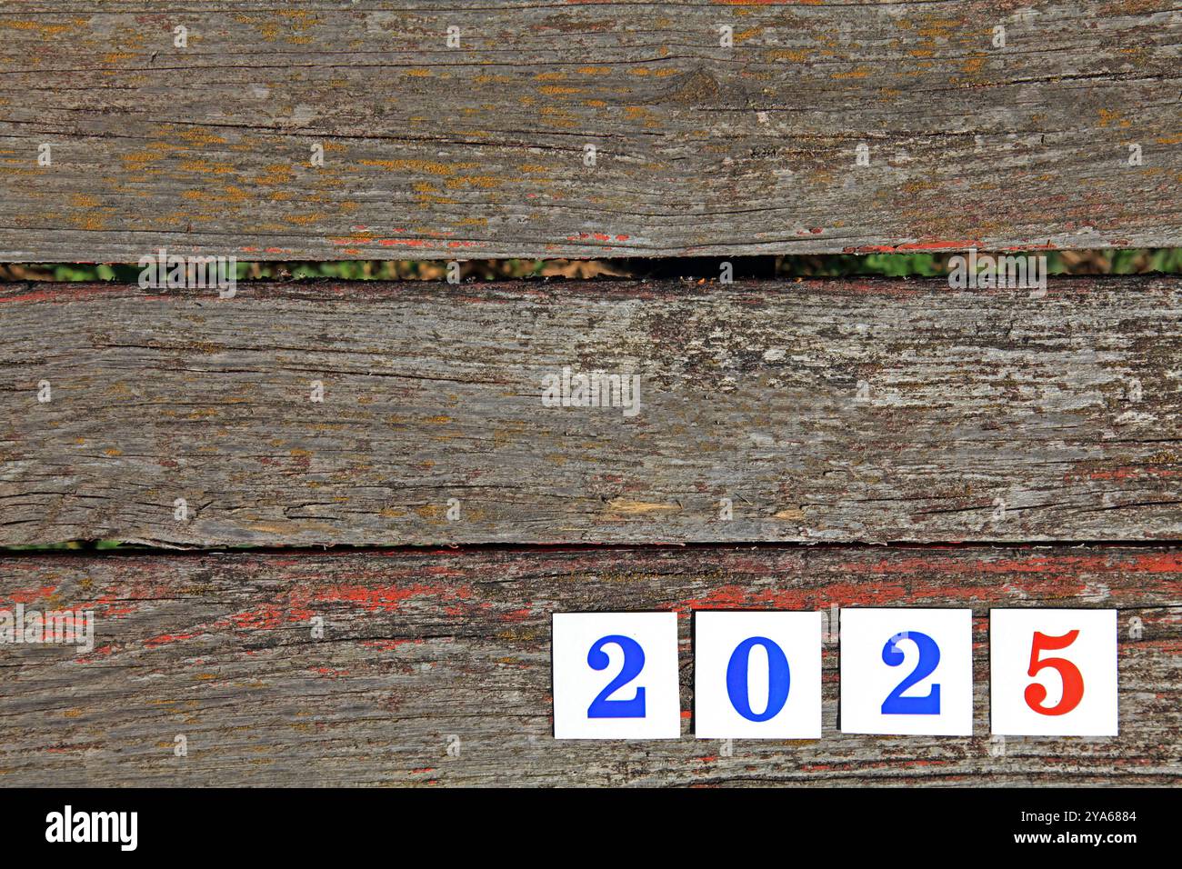 Numbers of 2025 year. Paper square numbers on the wooden background ...