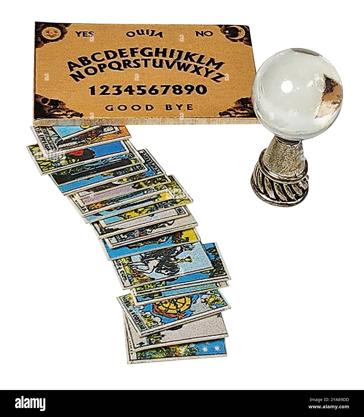 Tarot reading with tarot cards and crystal ball with an ouija board ...