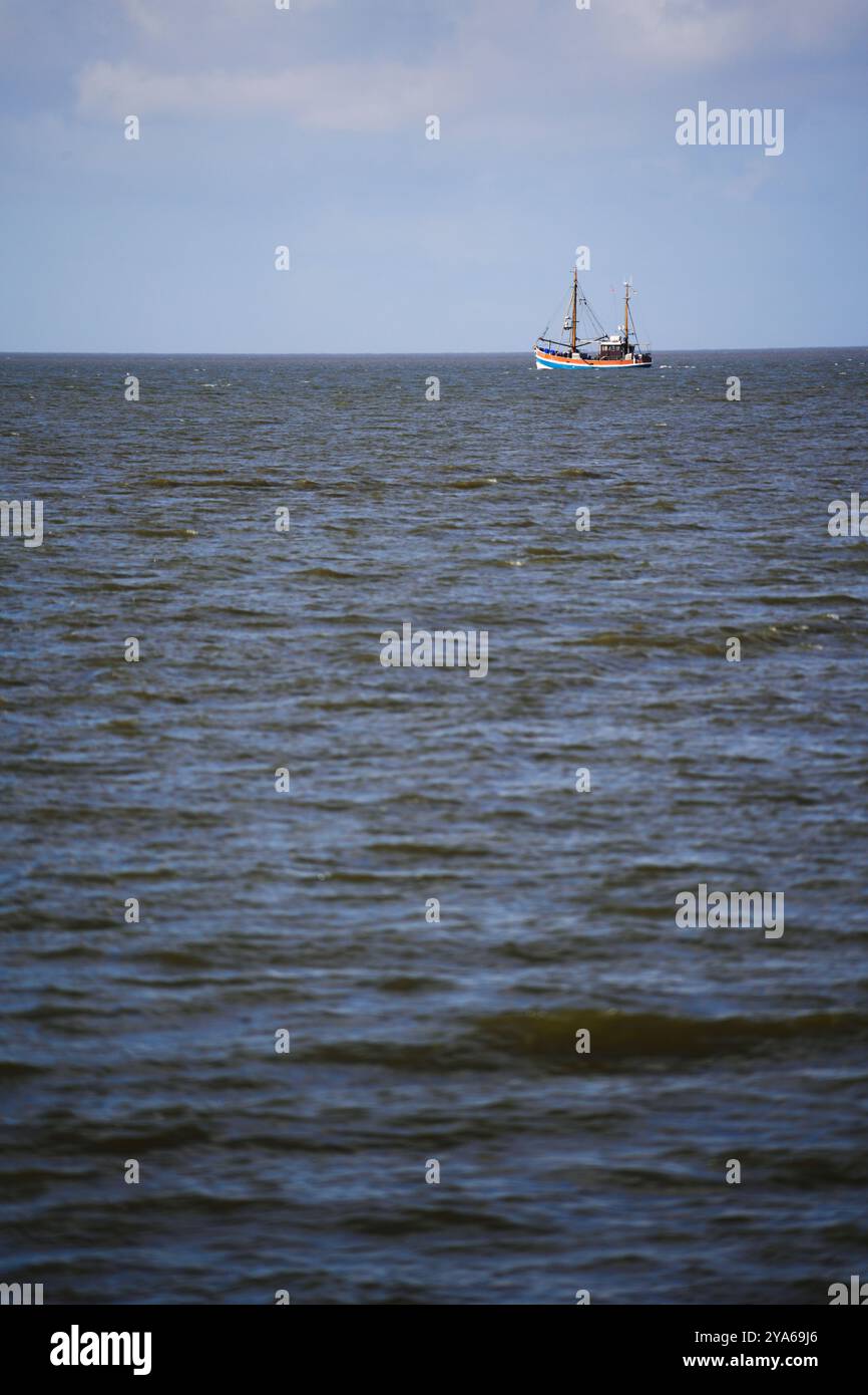 Norddeich, East Frisia ,Germany. Shrimp boat in action on the Horizon ...