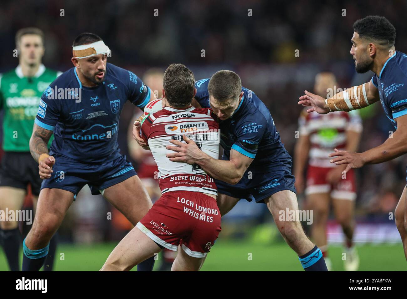 Matt Parcell of Hull KR tackles Jai Field of Wigan Warriors during the ...